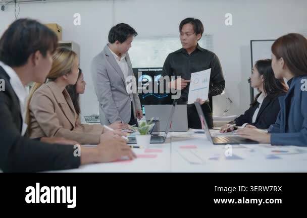 Business team discussing project during meeting presentation in office ...