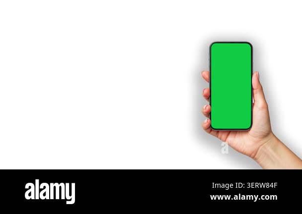 A hand holding a smartphone with a bright green screen (greenscreen ...