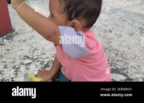 little asian girl playing with her dog Stock Video Footage - Alamy