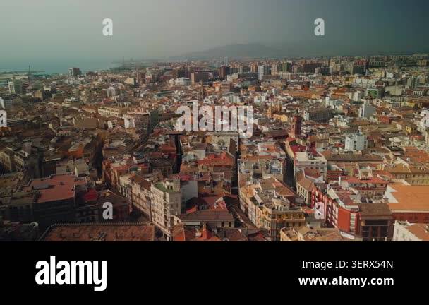 Drone view over Malaga historic center featuring dense urban ...