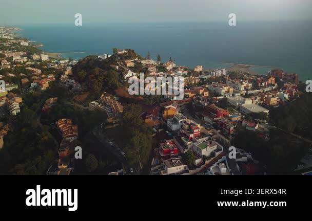 Drone flight above an upscale seaside district in Malaga featuring ...