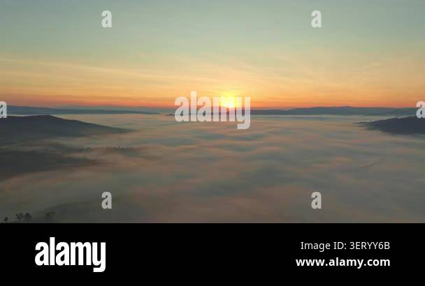 Aerial drone footage captures a breathtaking sunrise over a sea of ...