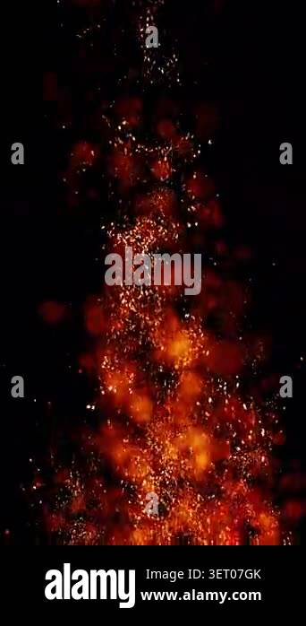 Glowing orange sparks and embers rise through space, creating a ...