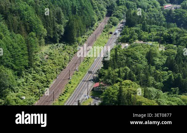 Aerial view of railway tracks surrounded by greenery Stock Video ...