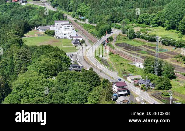 Aerial view of winding road through green landscape Stock Video Footage ...