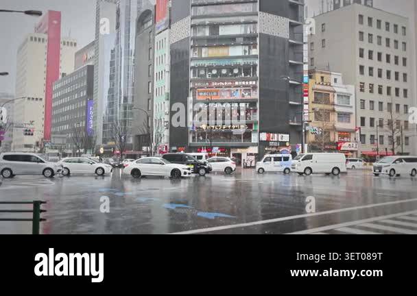 Tokyo Japan February 23, 2026: Rainy Day Traffic and Pedestrians in ...
