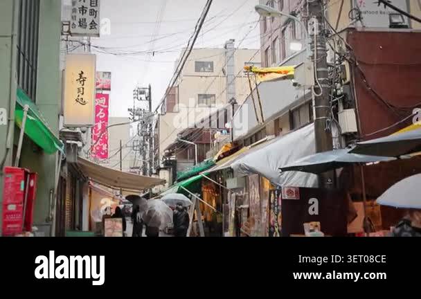Rainy Japanese Market Alley Pedestrians Umbrellas Street Scene. High ...
