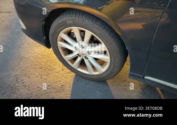 Inspected intact tire on parked sedan, clear tread pattern, westlake ...