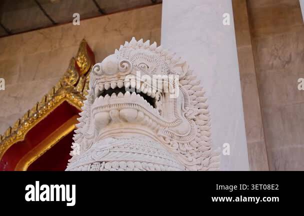 Carved white guardian lion statue closeup at temple entrance, detailed ...