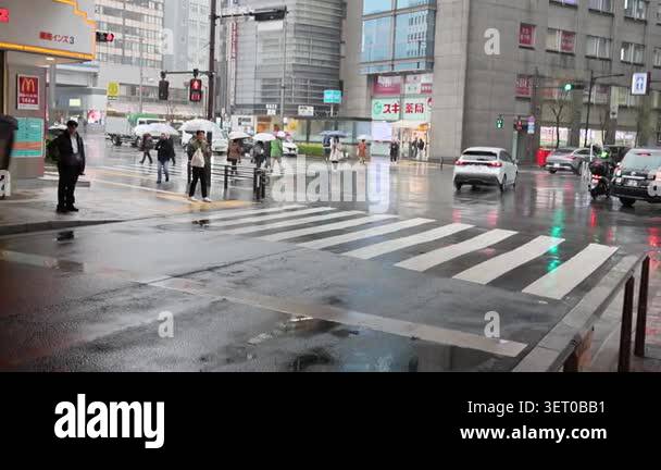 Tokyo Japan February 23, 2026: Rainy Tokyo Intersection Traffic and ...