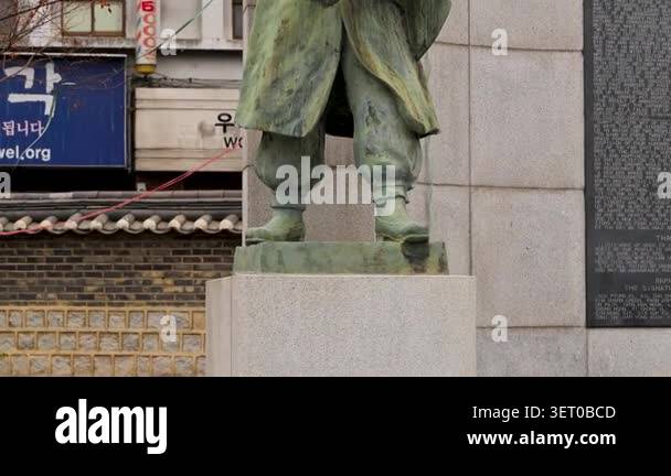 Close up bronze statue legs detail showing patina on cloak and cast ...