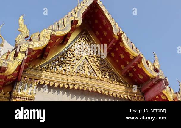Gilded gable detail under clear sky, closeup of filigree carving and ...