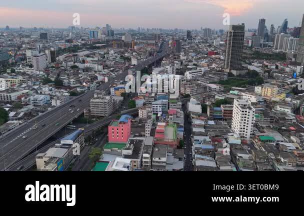 Aerial view of elevated highway and dense urban skyline in Bangkok at ...