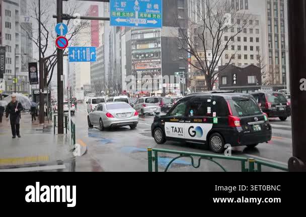 Tokyo Japan February 23, 2026: Rainy Ginza Tokyo Street With Taxi and ...