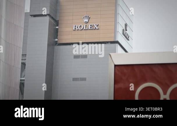 Tokyo Japan February 23, 2026: Rolex Building Exterior During Rainstorm ...