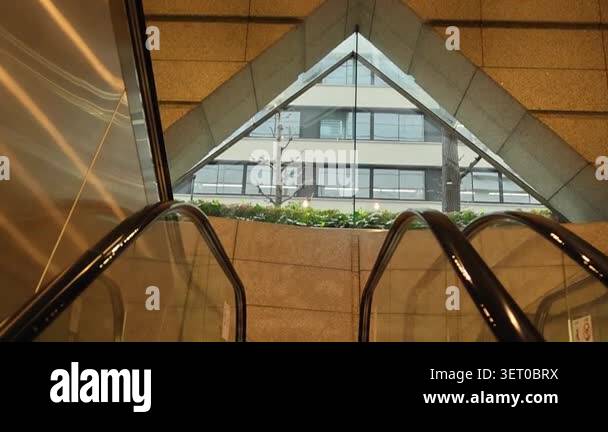 Modern Escalator Leading Through Glass Architecture Interior. High ...