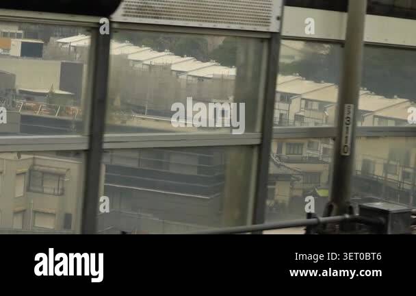 Tokyo Urban Buildings Reflection Through Glass From Moving Bus. High ...