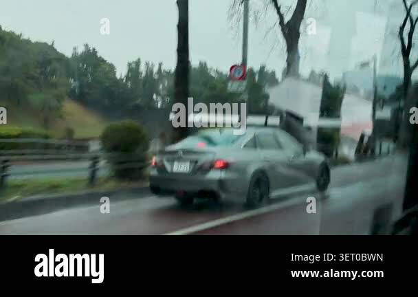 Tokyo Japan February 23, 2026: Rainy Tokyo Sedan Traffic Urban Driveby ...