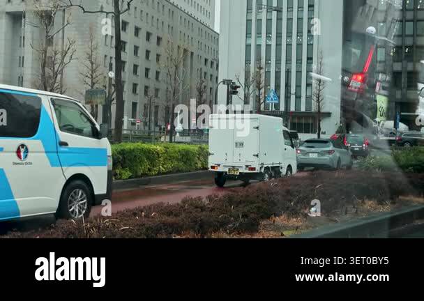 Tokyo Japan February 23, 2026: Tokyo City Traffic Driving Through Rainy ...