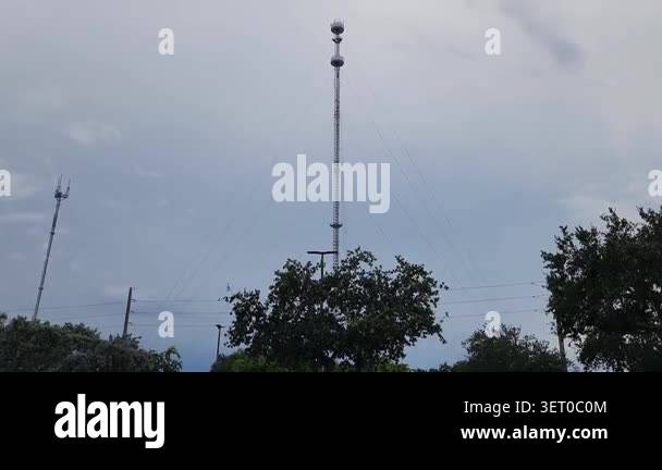 Telecommunication tower equipped with multiple antennas rising above ...