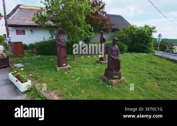 Tihany, Hungary - May 19, 2026: Wooden sculptures depicting human ...