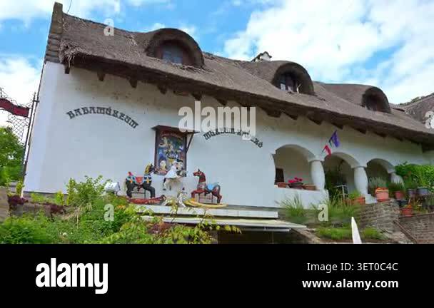 Tihany, Hungary - May 19, 2026: Historic thatched-roof house housing a ...