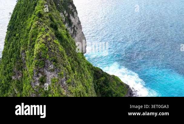 Drone aerial view of the dramatic limestone cliff ridge at Kelingking ...