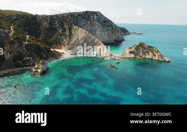 Aerial view of hidden beach Agia Eleni by rocky cliffs and sea in ...