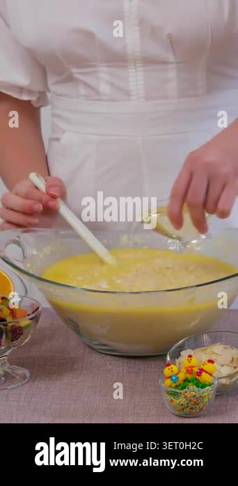 Female hands making soft layered cruffin dough with butter, dried ...