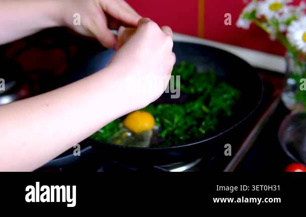 Fresh spinach is cooked with eggs and creamy cheese in a skillet, then ...