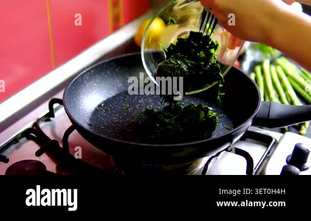 Fresh spinach is cooked with eggs and creamy cheese in a skillet, then ...