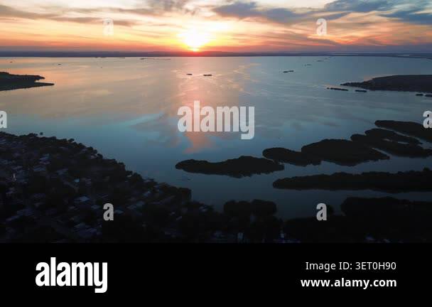 Epic cinematic 4K aerial travel shot moves over Pueblo Viejo Lagoon at ...