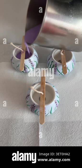 Pouring Purple Liquid Soy Wax into Handmade Plaster Jars, Vertical DIY ...