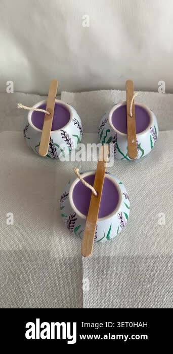 Handmade lavender scented candles craft process with wooden wick ...