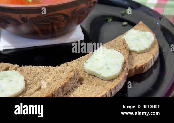 Traditional Ukrainian borscht served with sour cream, fresh herbs ...