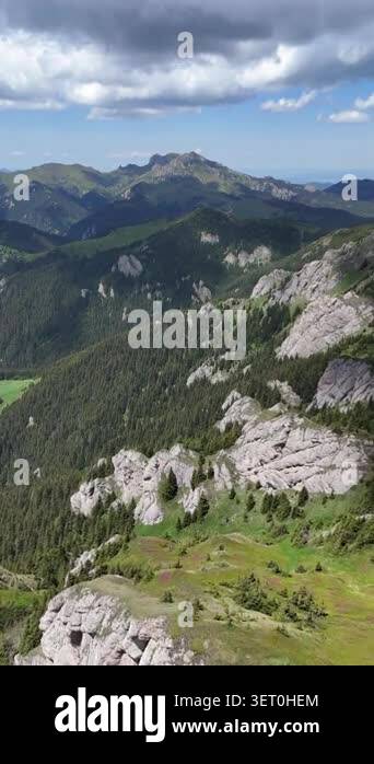 Ciucas Mountains limestone cliffs and spruce forest aerial view Romania ...