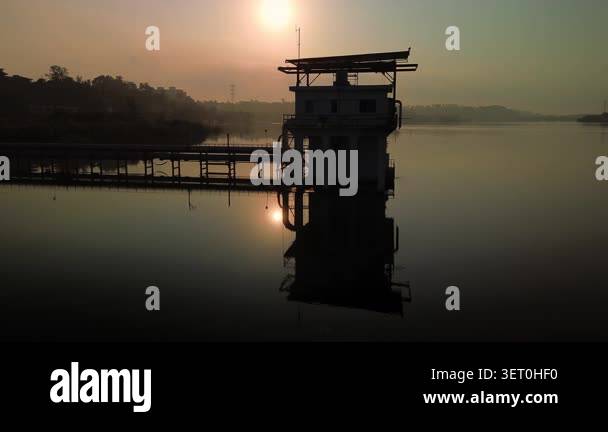 Aerial drone skims just above the surface of Chairel Lagoon at dawn in ...