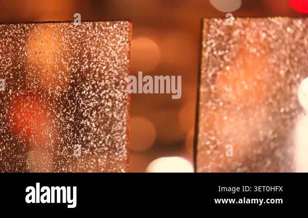 Cinematic rainy city lights behind wet window glass at night. High ...