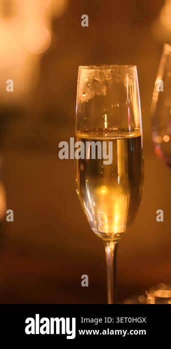 Romantic evening champagne and wine glasses with city bokeh lights warm ...