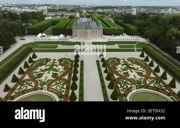 Drone flies over Domaine Departemental de Sceaux showing the chateau ...