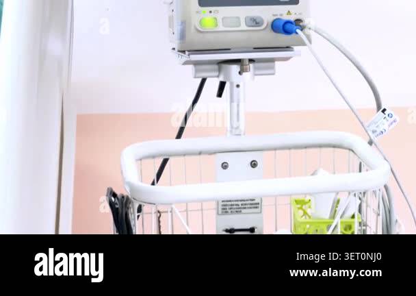 Patient monitor displaying vital signs including heart rate, blood ...