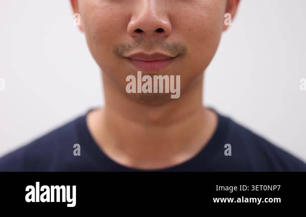 Close up face of asian man smile slow motion Stock Video Footage - Alamy