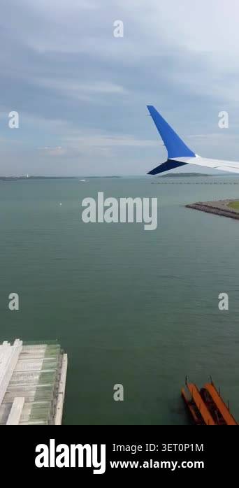 4K vertical POV footage captured from a passenger airplane window ...