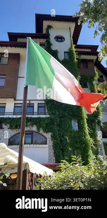 Vertical 4K slow motion view of the national flag of Ireland waving on ...