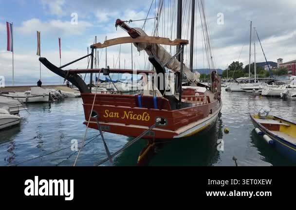 Bardolino, Italy - May 14, 2026 - Sailing boats docked in a serene ...