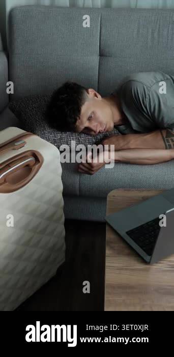 Decision overload in a life of constant movement. Man closing laptop ...