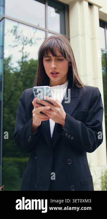 Portrait of a sad and disappointed woman using a smartphone, reacting ...