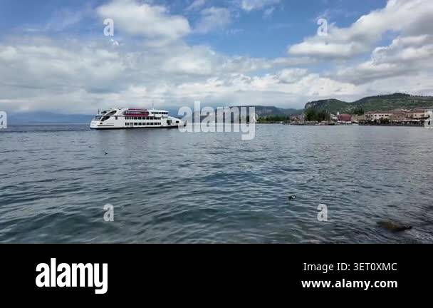 Bardolino, Italy - May 14, 2026 - Scenic ferry boat sailing on a calm ...