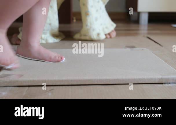 Toddler making painted footprints on cardboard close up Stock Video ...