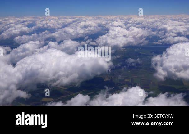 Aerial view from an airplane window flying above a vast expanse of ...